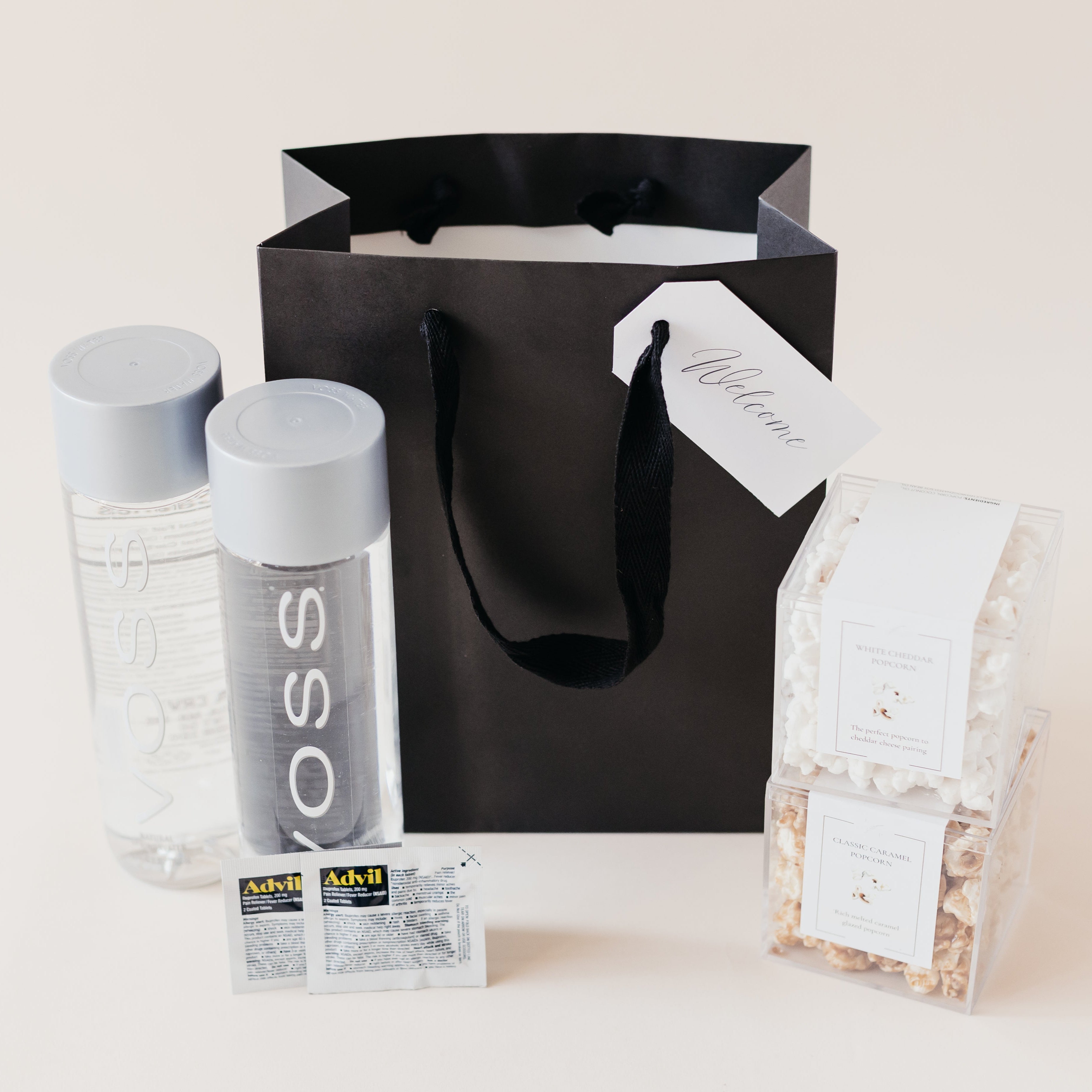 Modern Welcome Gift Bag with Voss or Pellegrino & Popcorn | L+P ...